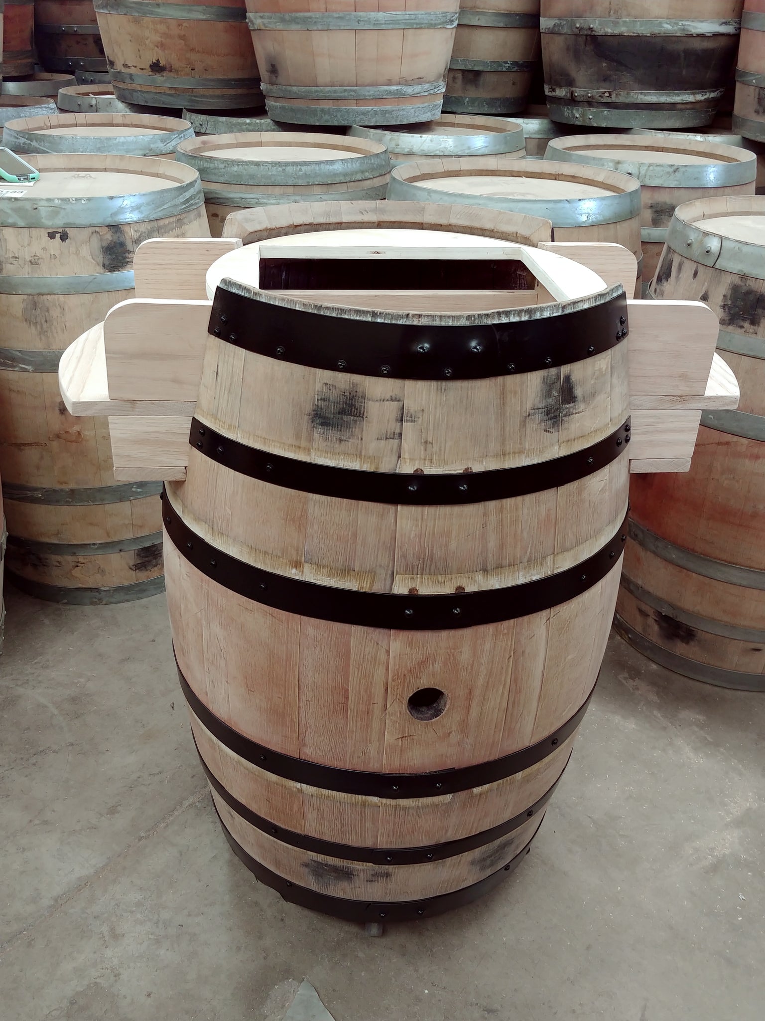 Raw barrel with black hoops and control panel and monitor cover